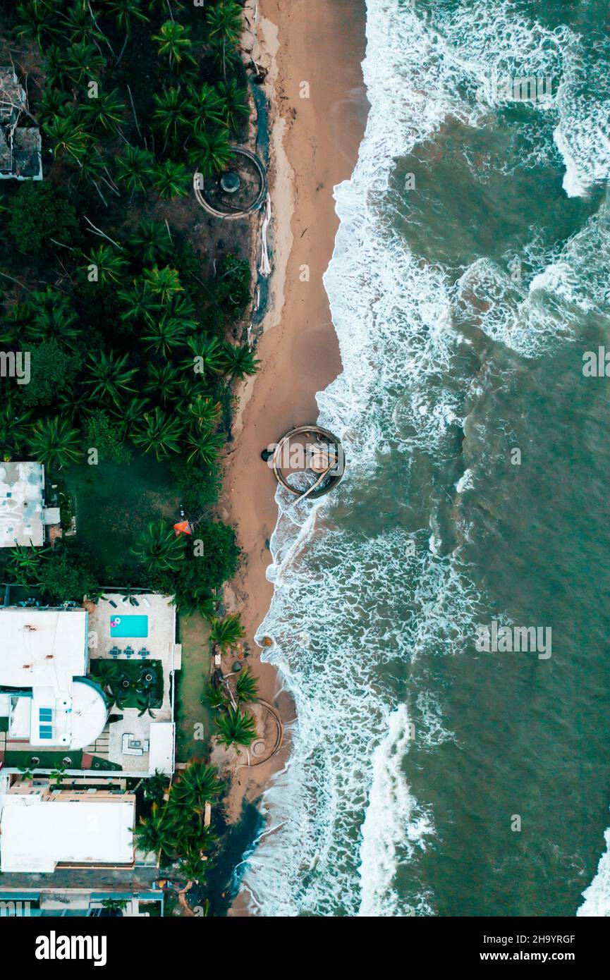 Bird's eye view of a beach and ruin of canon in Aguada, Puerto Rico ...