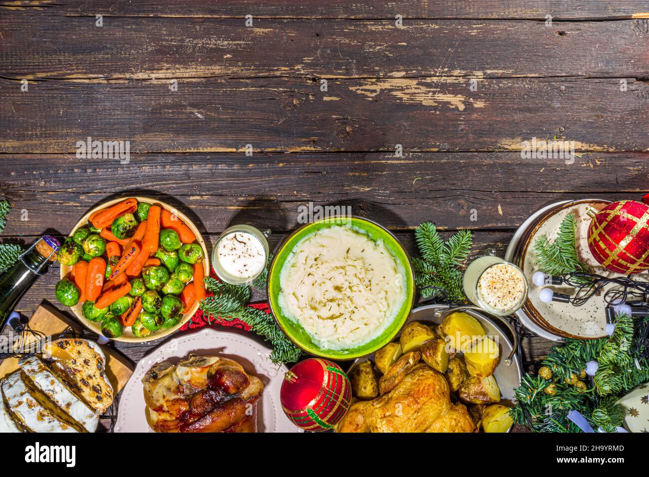 Festive Christmas dinner table with traditional foods and dished ...