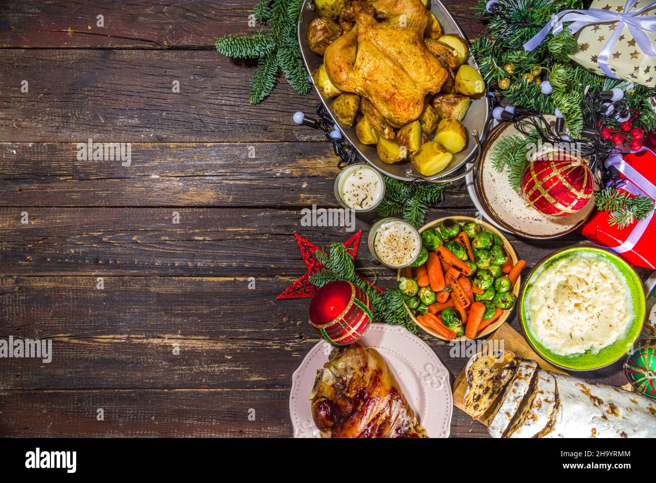 Festive Christmas dinner table with traditional foods and dished ...