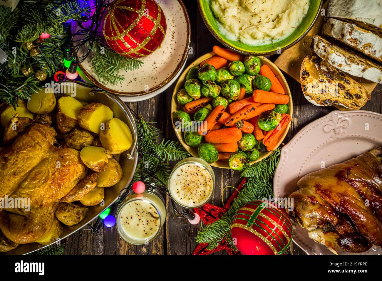 Festive Christmas dinner table with traditional foods and dished ...