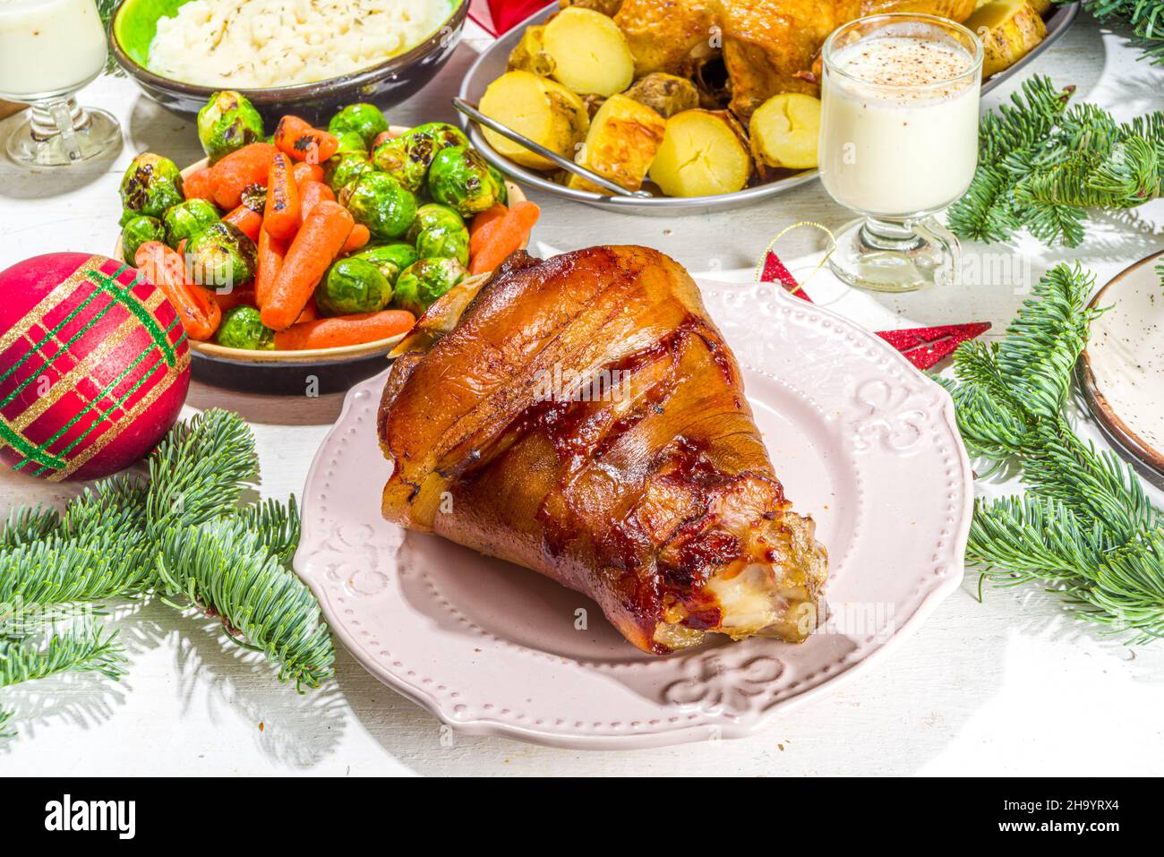 Festive Christmas dinner table with traditional foods and dished ...