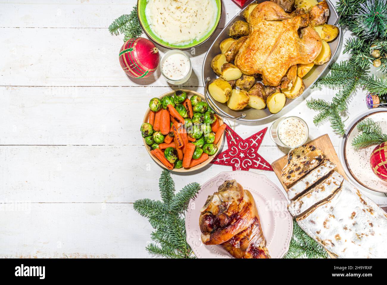 Festive Christmas dinner table with traditional foods and dished ...