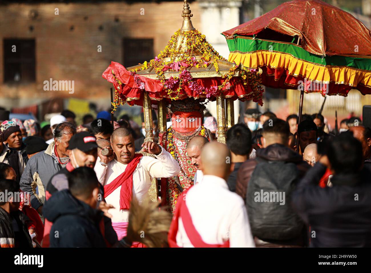 Lalitpur, Bagmati, Nepal. 9th Dec, 2021. Devotees carries the idol of ...