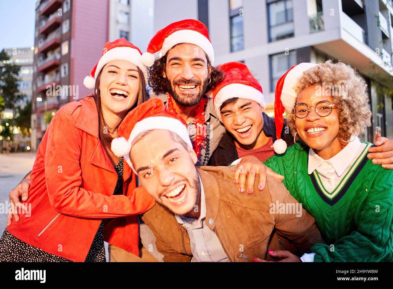Selfie of a Group of Friends wearing Santa Claus hat. People ...