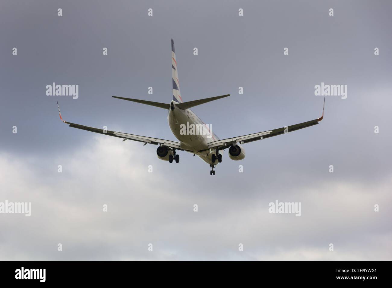 Passenger aircraft on approach to the airport for landing Stock Photo ...