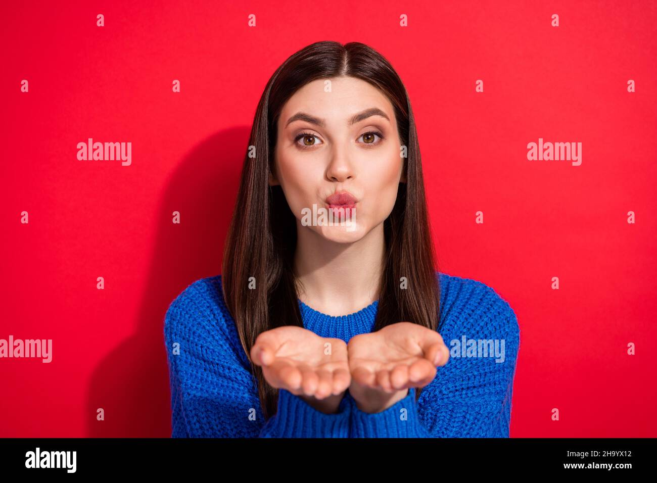 Photo portrait brunette sending air kiss to you on date dreamy in blue ...