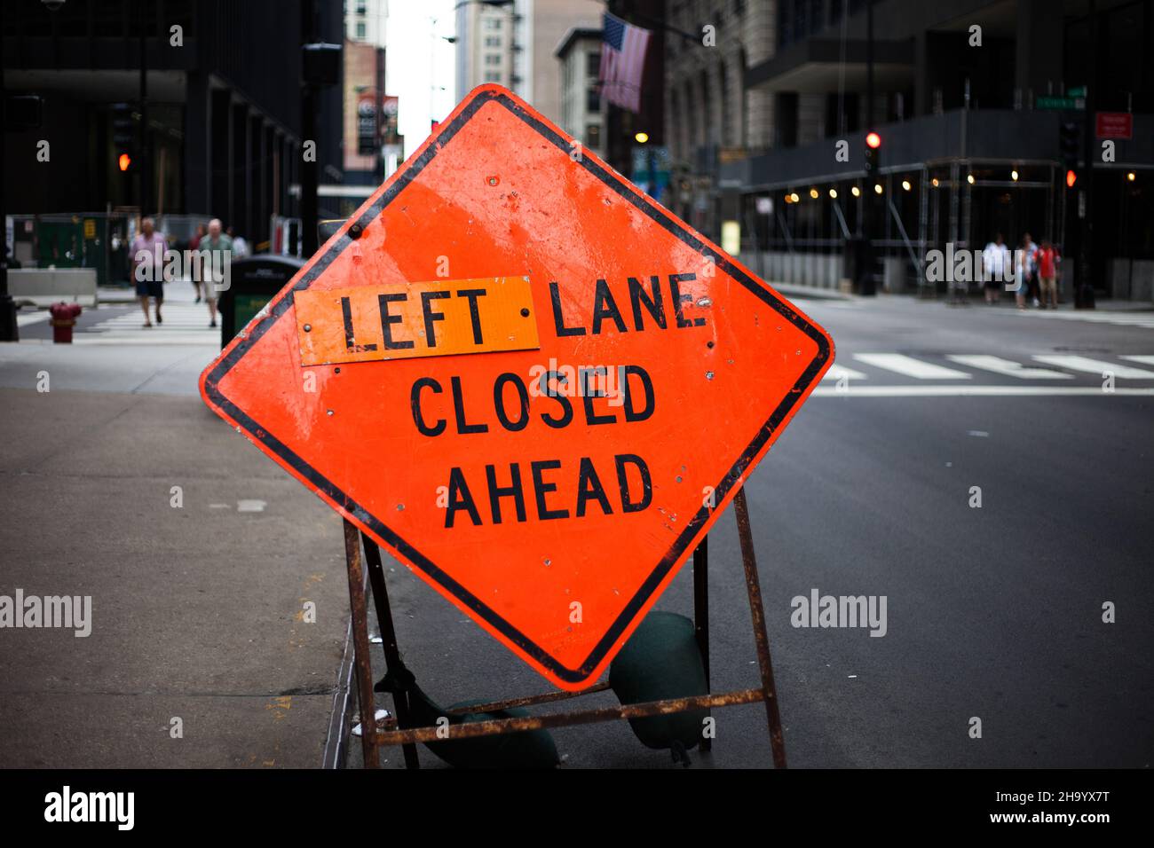 Sign left Lane closed ahead Stock Photo - Alamy