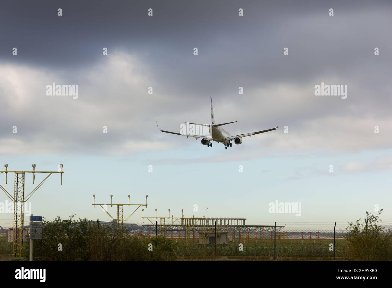 Passenger aircraft on approach to the airport for landing Stock Photo ...