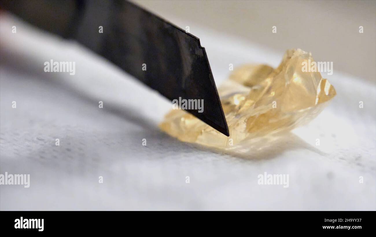 Translucent amber sample. Close-up of small sample of translucent amber ...