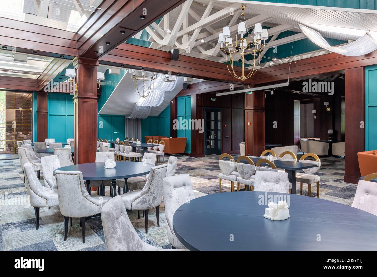 the interior of an expensive restaurant with huge beams under the ...