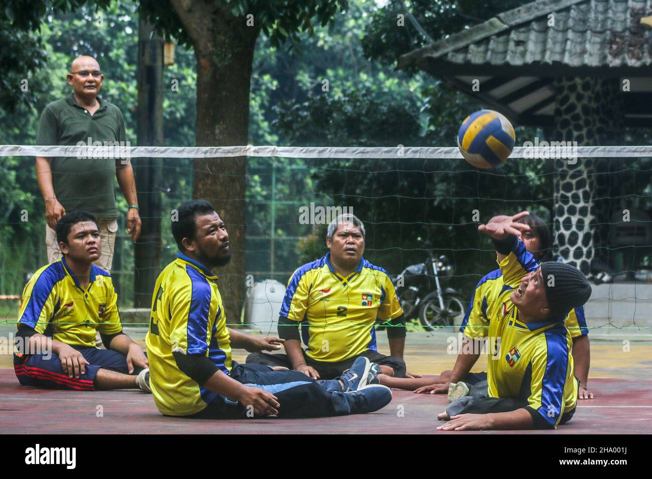 Person with disability in action during a Sitting Volleyball training ...