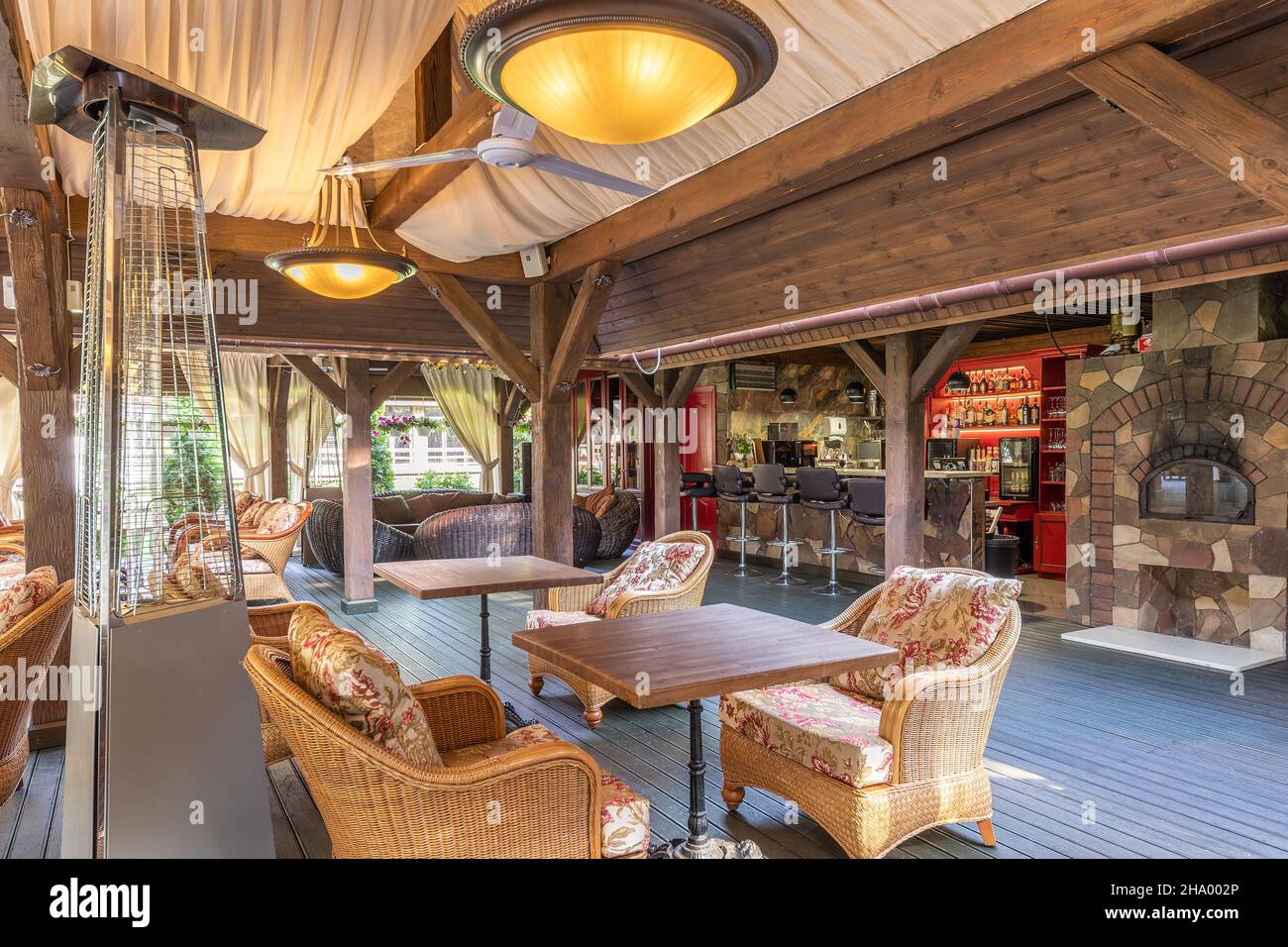 the interior of an outdoor summer cafe without visitors with a bar ...
