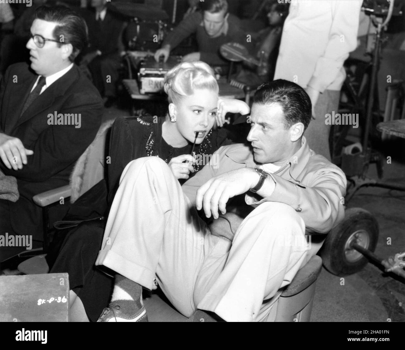 MARILYN MAXWELL and Producer STANLEY KRAMER on set candid during filming of CHAMPION 1949 ...