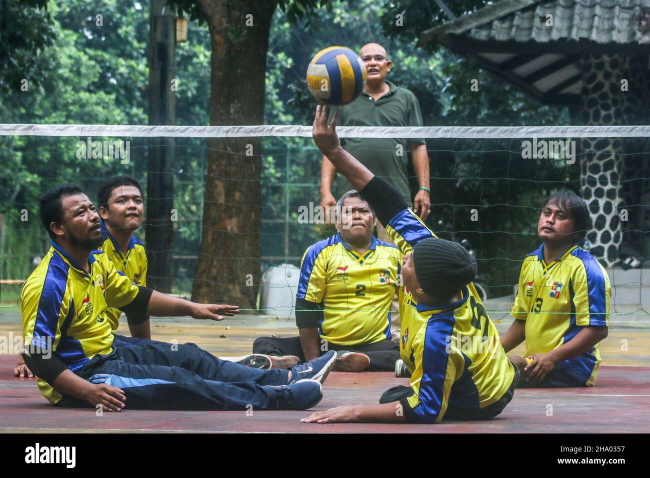Person with disability in action during a Sitting Volleyball training ...