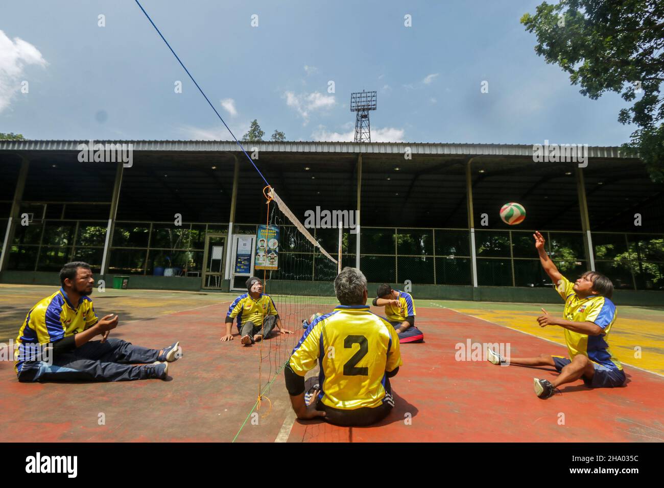 Person with disability in action during a Sitting Volleyball training ...