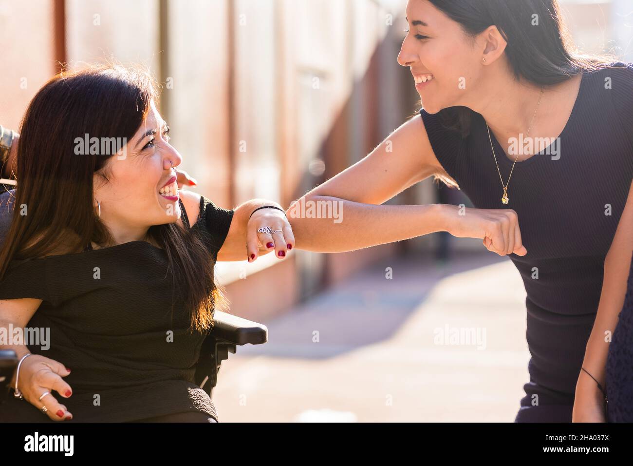 Elbow bump hispanic hi-res stock photography and images - Alamy