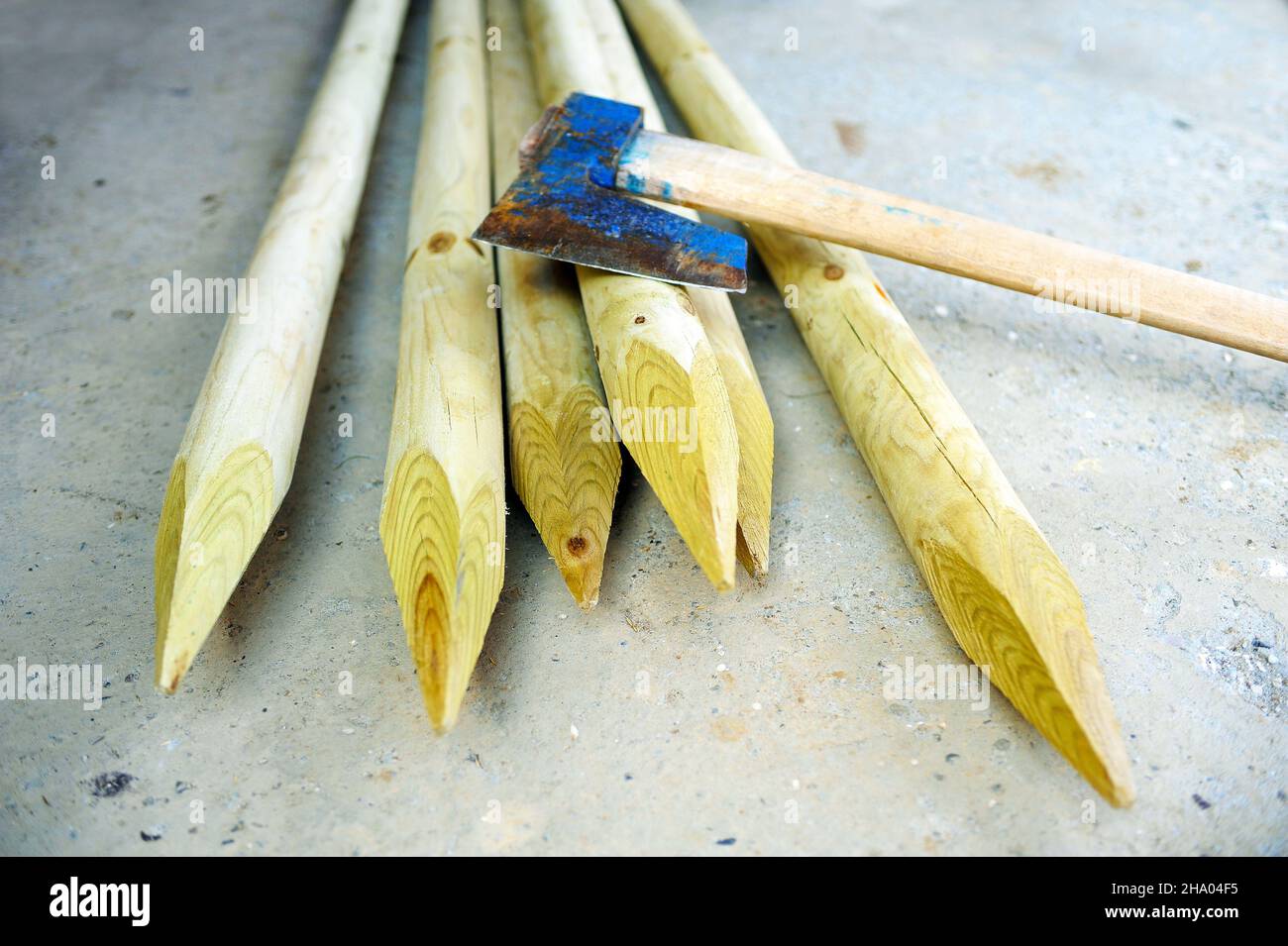 a few wooden stakes with axe ready for construction works Stock Photo ...