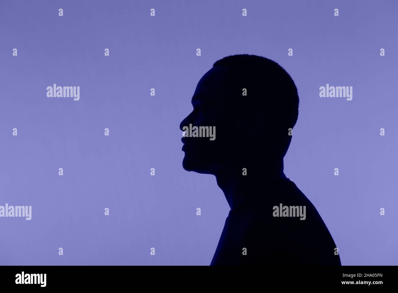 Man silhouette pose on very peri colour of 2022 background Stock Photo ...