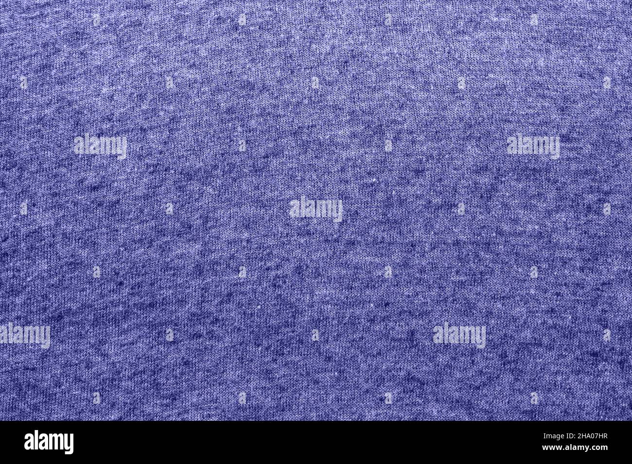 The texture of a knitted woolen fabric in very peri trendy color of the ...