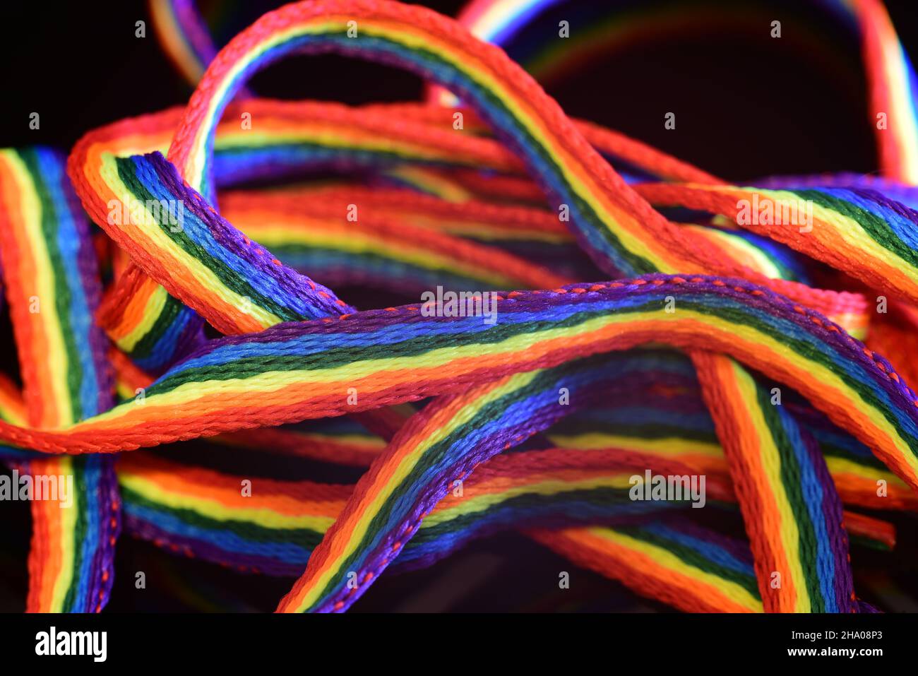 Rainbow Laces on black background Stock Photo - Alamy
