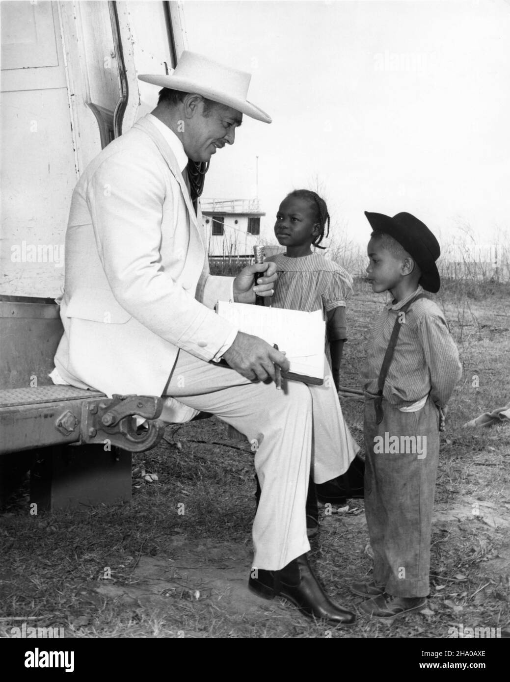 CLARK GABLE on set location candid with two African American child ...