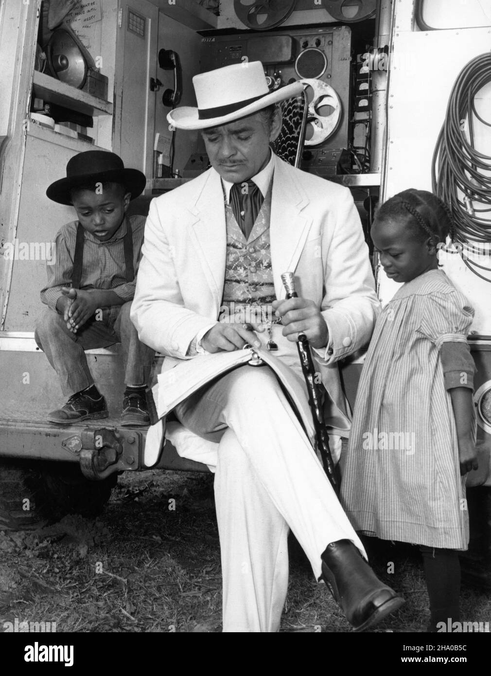 CLARK GABLE on set location candid with two African American child ...