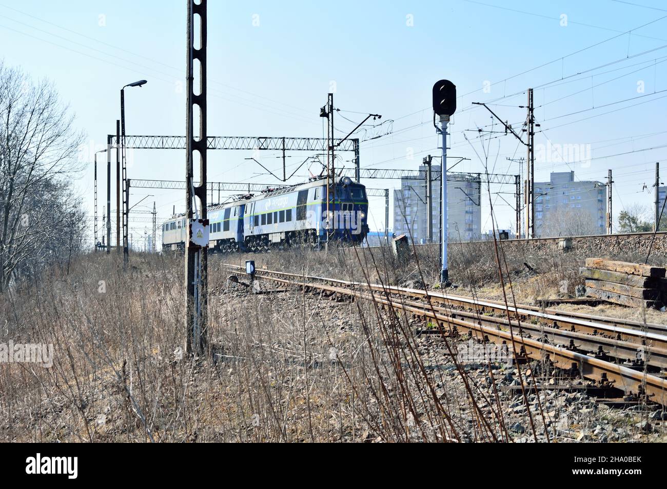 Electric locomotive pulling a loaded train on a sunny day. Day Stock ...