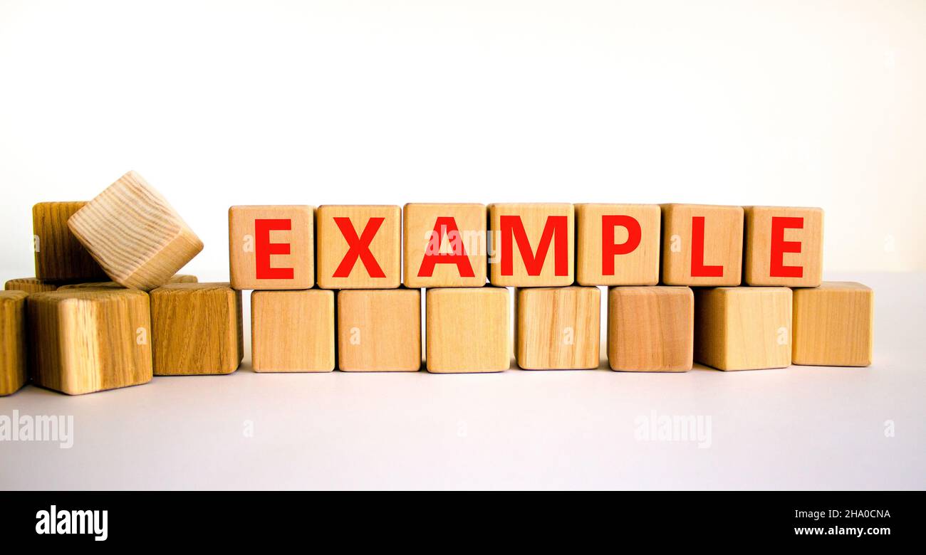 Example symbol. The concept word Example on wooden cubes. Beautiful ...
