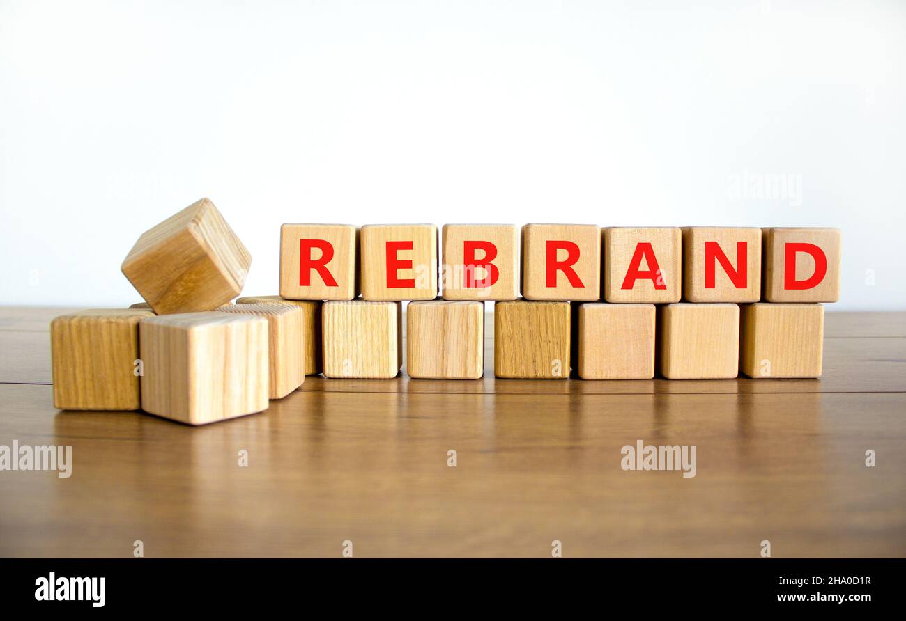 Rebrand and brand symbol. The concept word Rebrand on wooden cubes ...