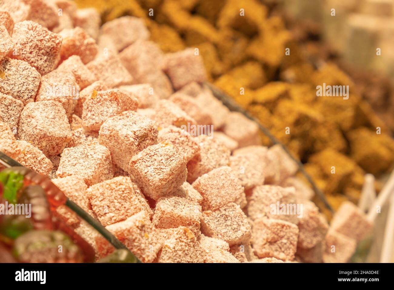 Turkish delights with coconut powder in the shop Stock Photo - Alamy