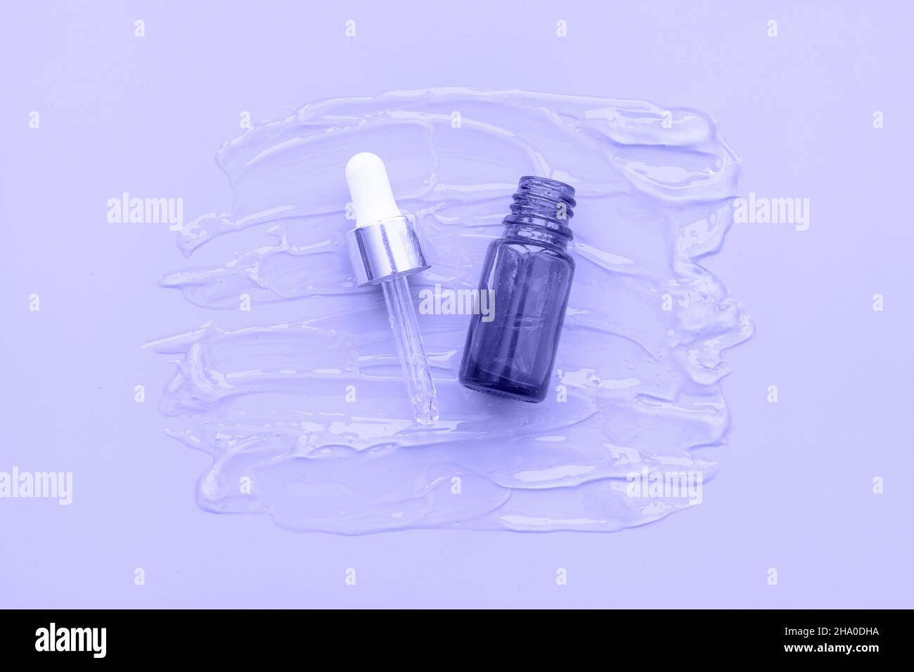 violet Serum drops or Liquid gel with pipette. Cosmetics products for ...