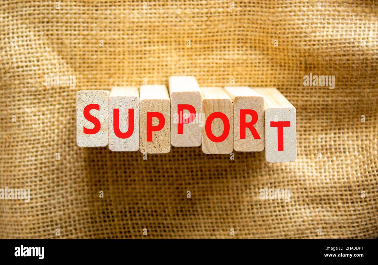 Support symbol. The concept word Support on wooden blocks. Beautiful ...