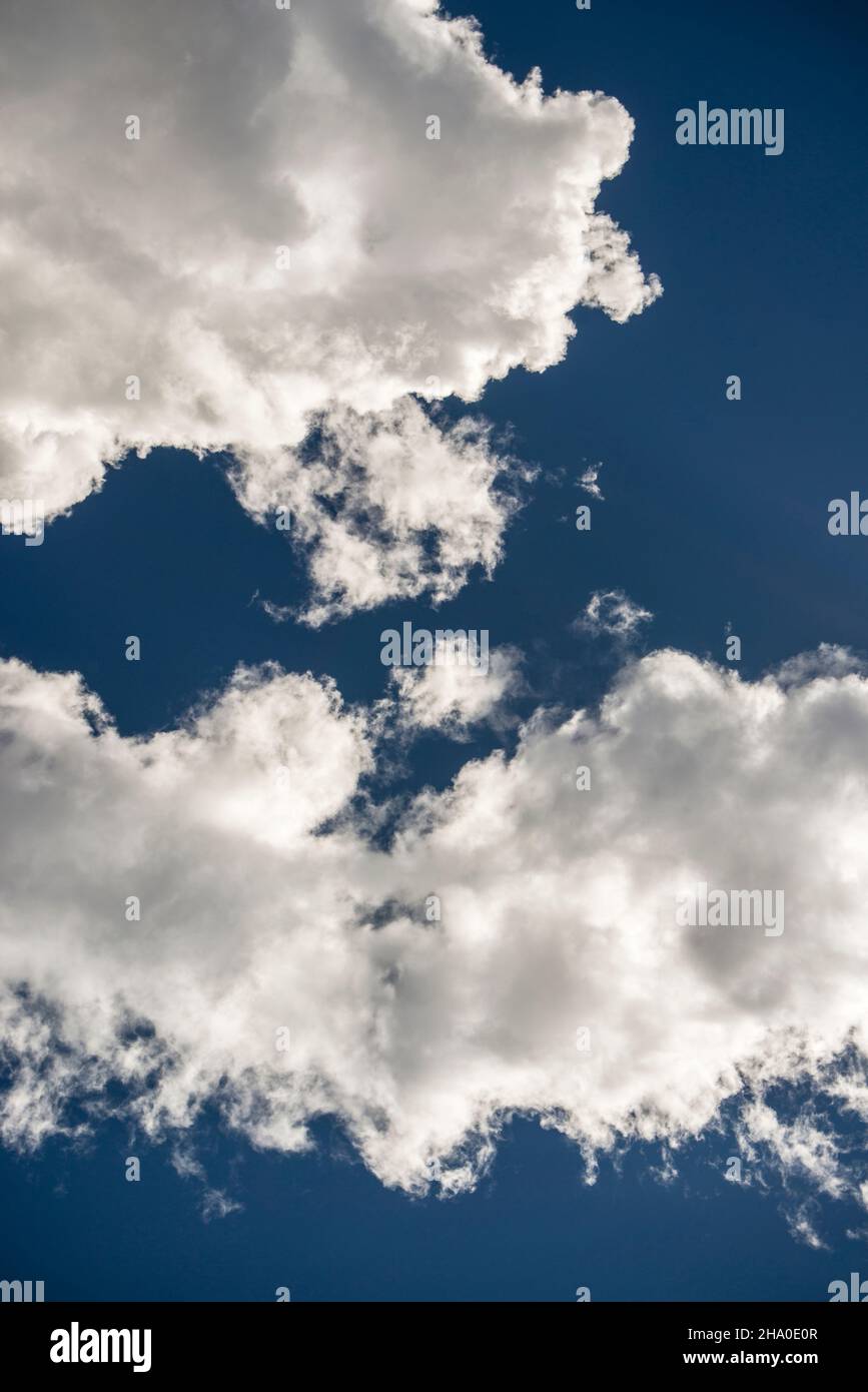 Elongated cloud in big blue sky Stock Photo - Alamy