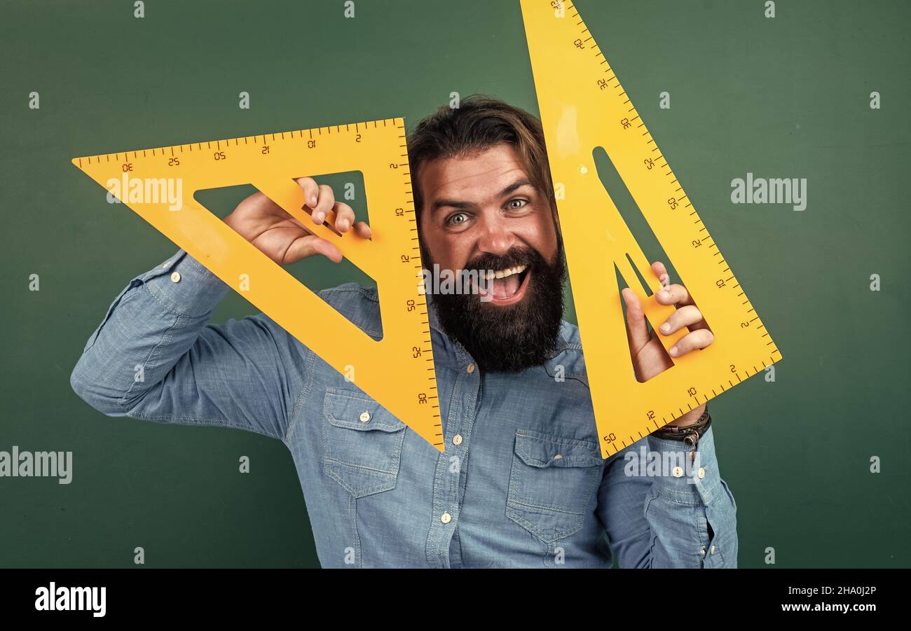 man happy with size measured on triangle ruler math tool, school study ...