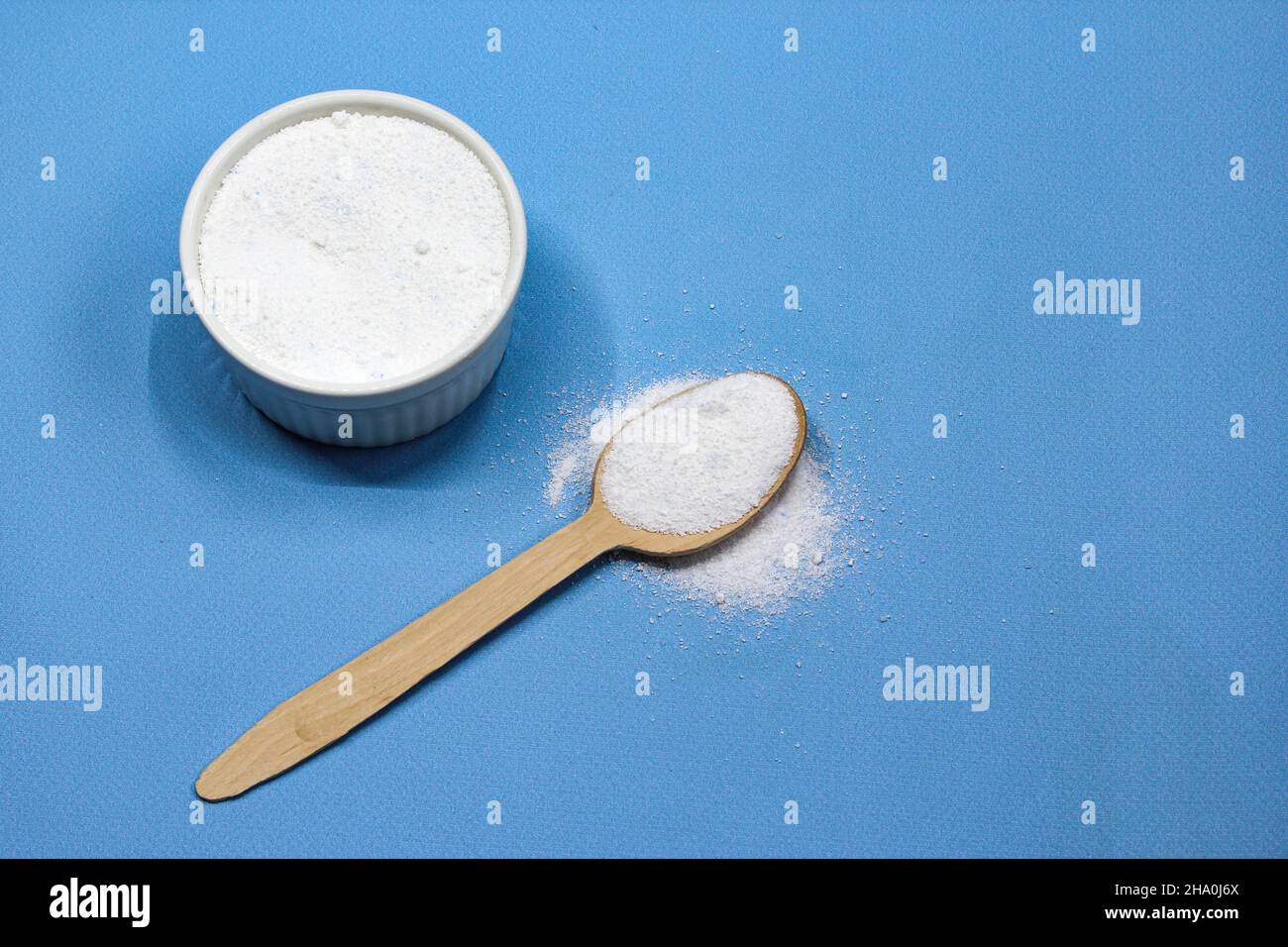 Collagen powder on blue background. Natural health supplement for skin ...