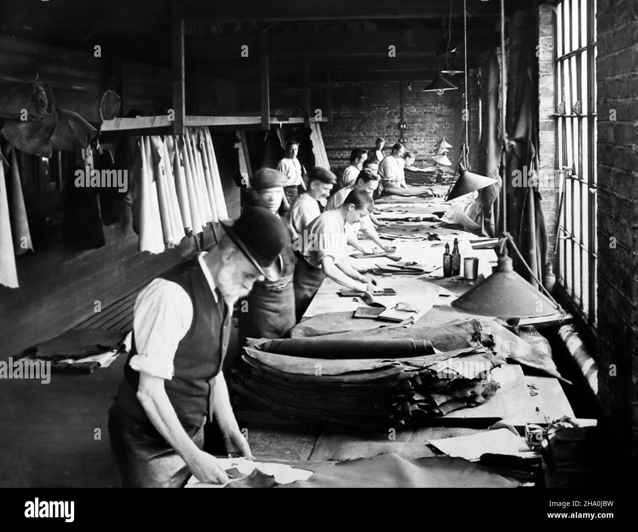 Finishing, leather production, Victorian period Stock Photo - Alamy