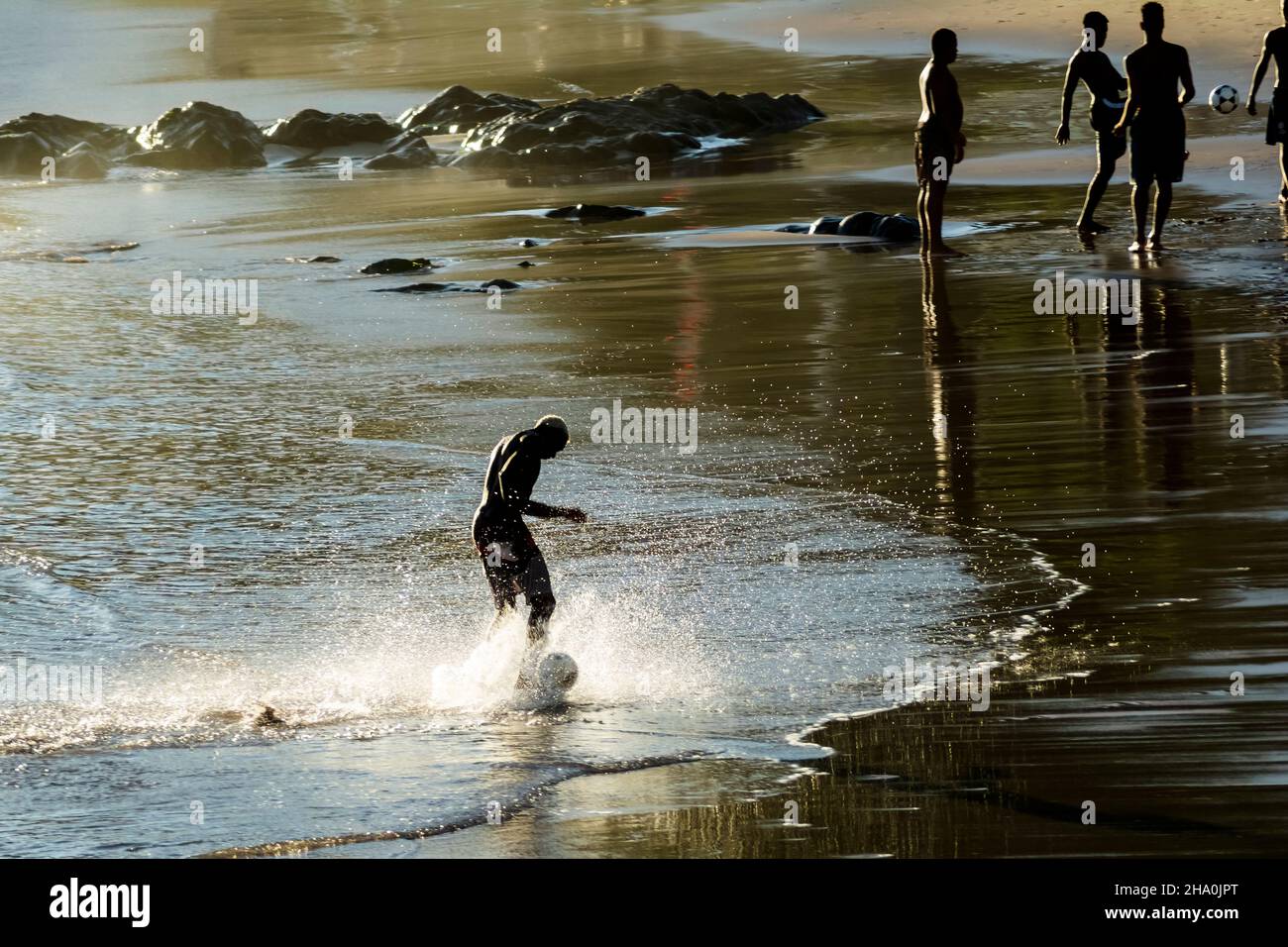 Young people playing sand football on the beach of Ondina in the ...
