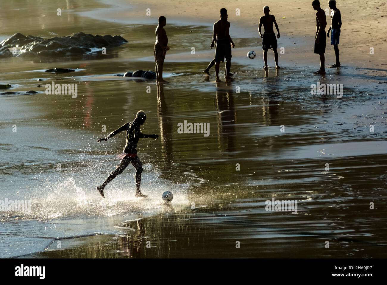 Young people playing sand football on the beach of Ondina in the ...