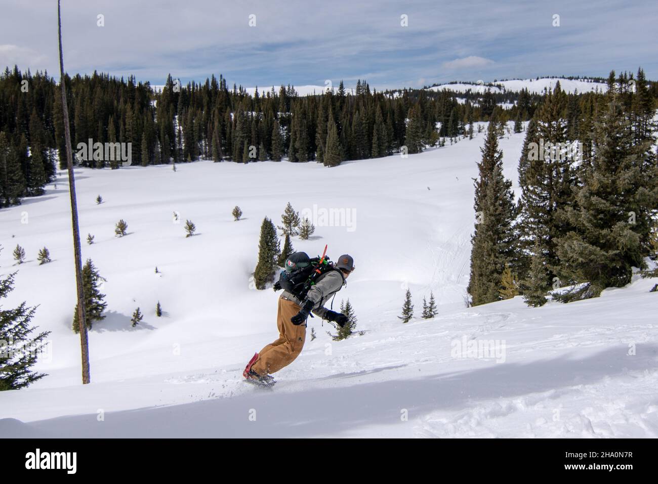 Male Snowboarder riding snow in colorado backcountry Stock Photo - Alamy