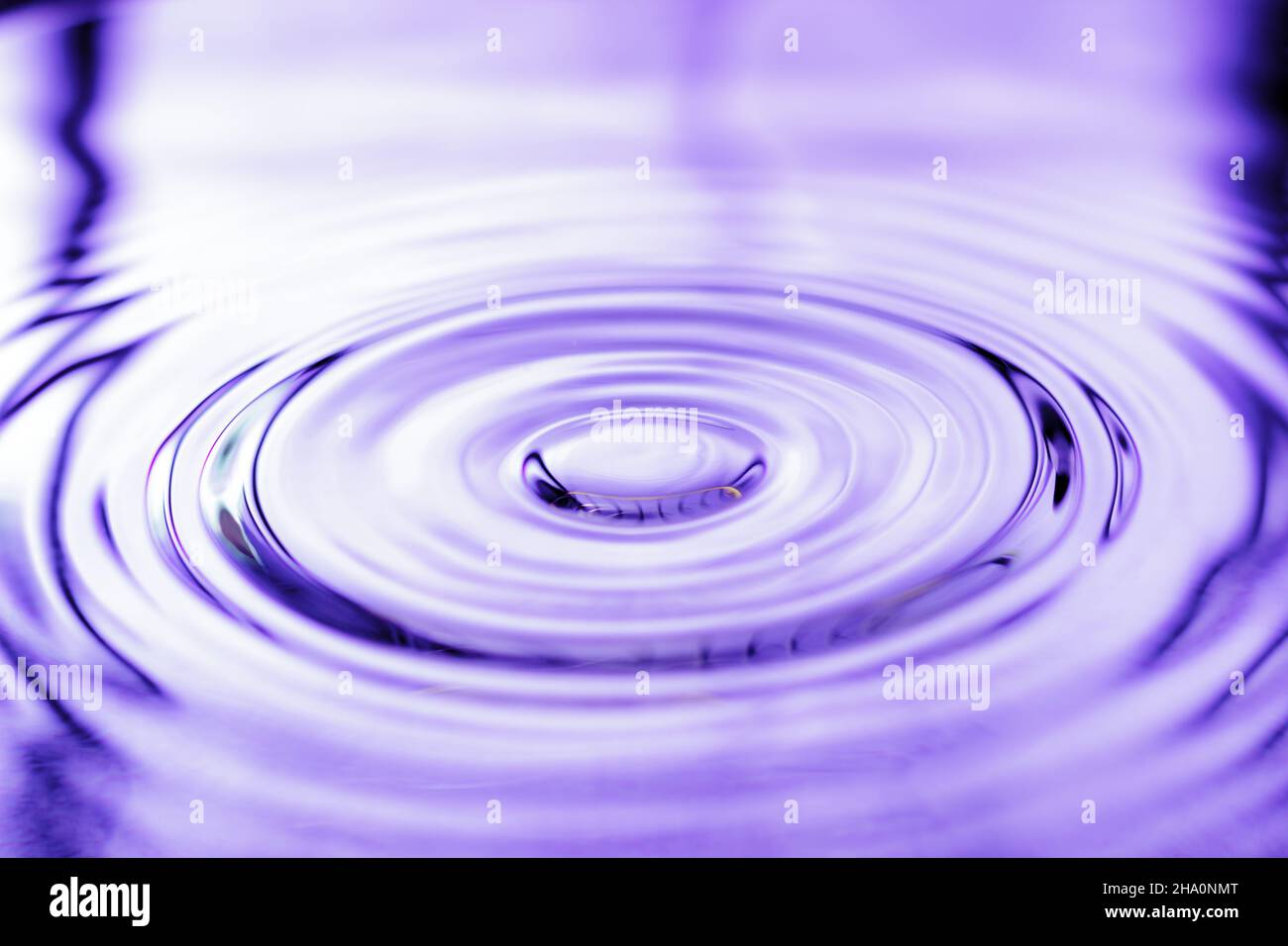 water drop splash on calm water base Stock Photo - Alamy