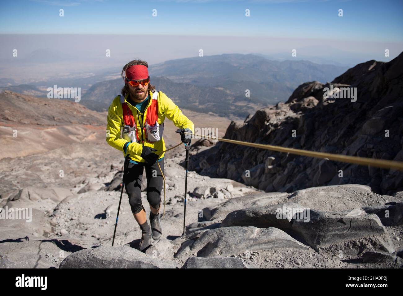 One man holding a fixed rope while climbing Pico de Orizaba Stock Photo ...