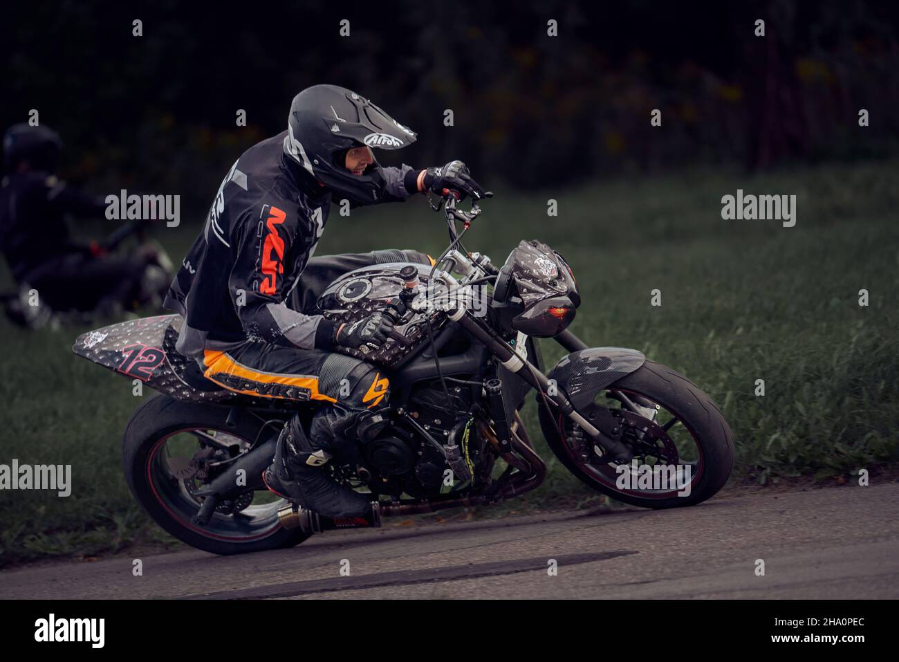 19-09-2021 Riga, Latvia A young man riding a motorcycle on an open road ...