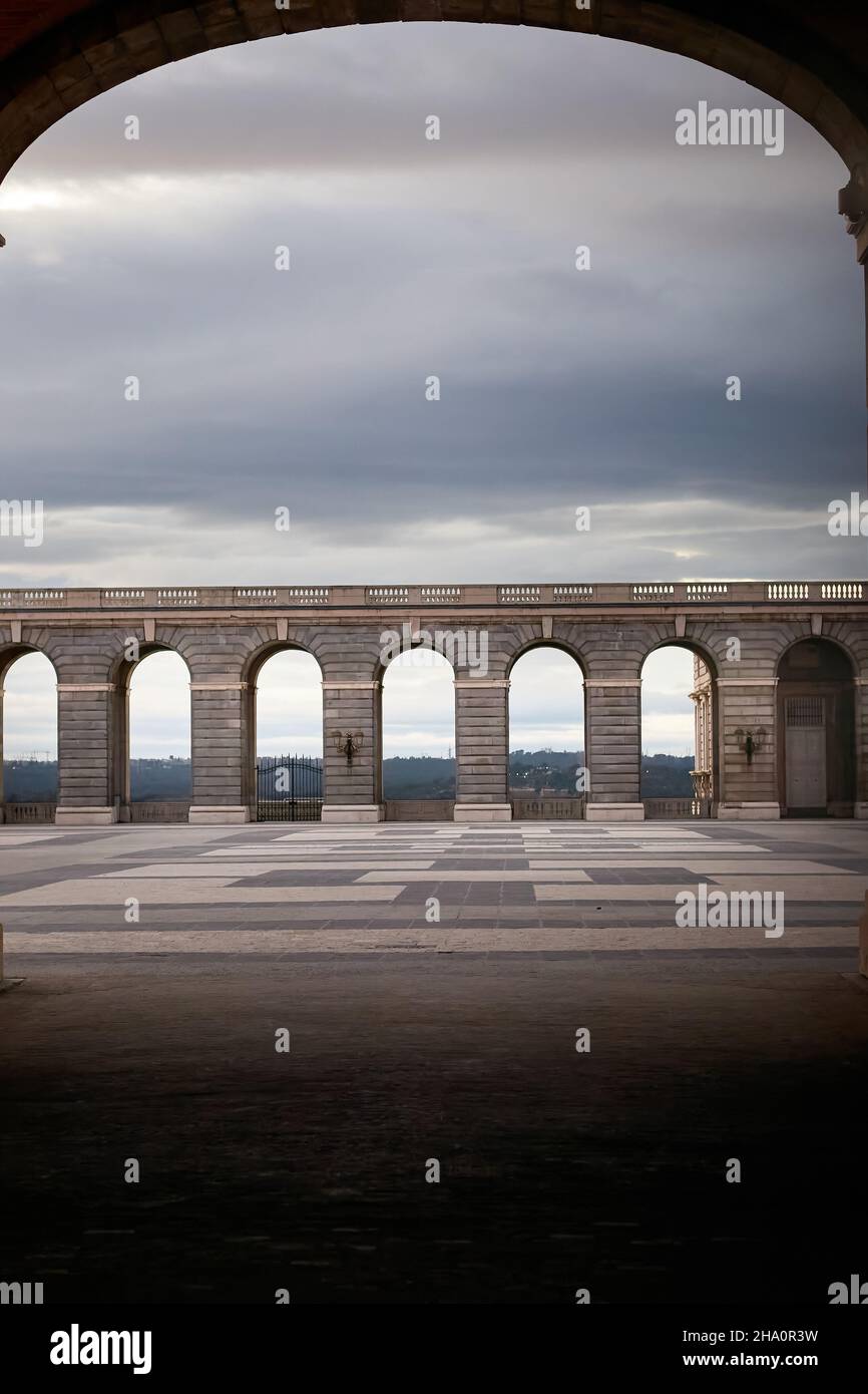 Row of arches in the distance seen through an arch in the foreground ...