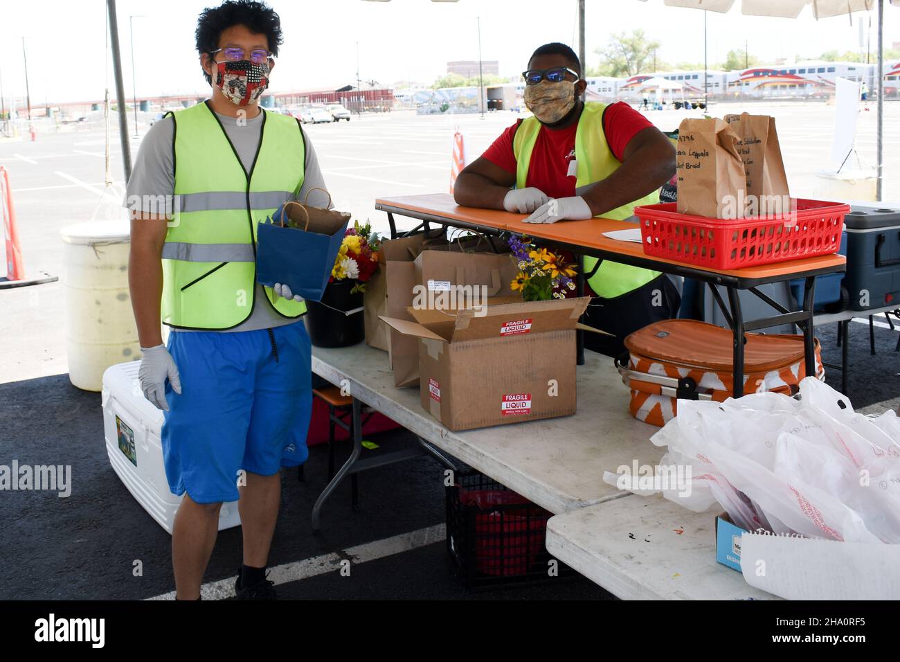 Food handouts at drive up food bank at the Railyard in June 2020 ...