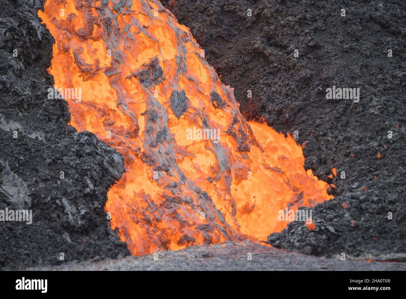 Drone view volcano caldera and flowing lava Stock Photo - Alamy
