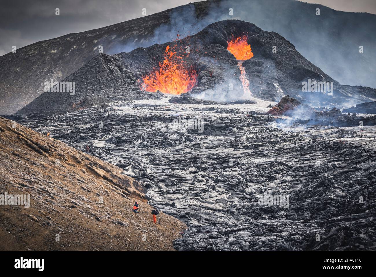 two volcano calderas in eruption Stock Photo - Alamy