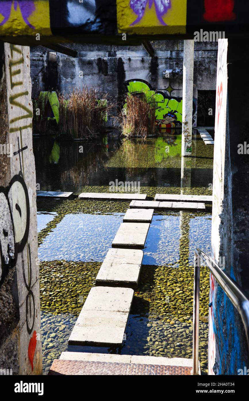 Stone Way through Water in an abandoned Industry Place Stock Photo - Alamy
