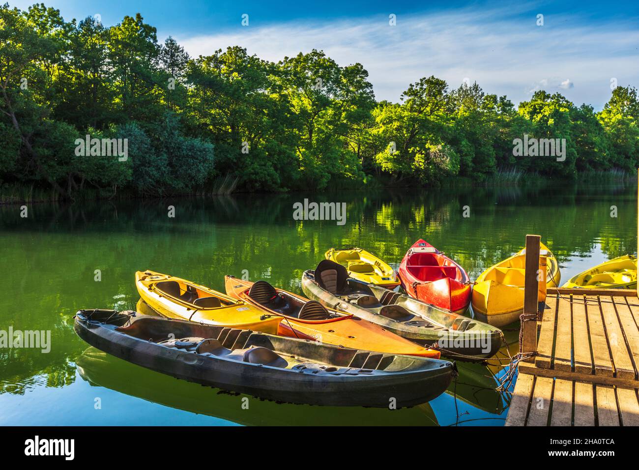 Colorful kayaks in a river Stock Photo - Alamy