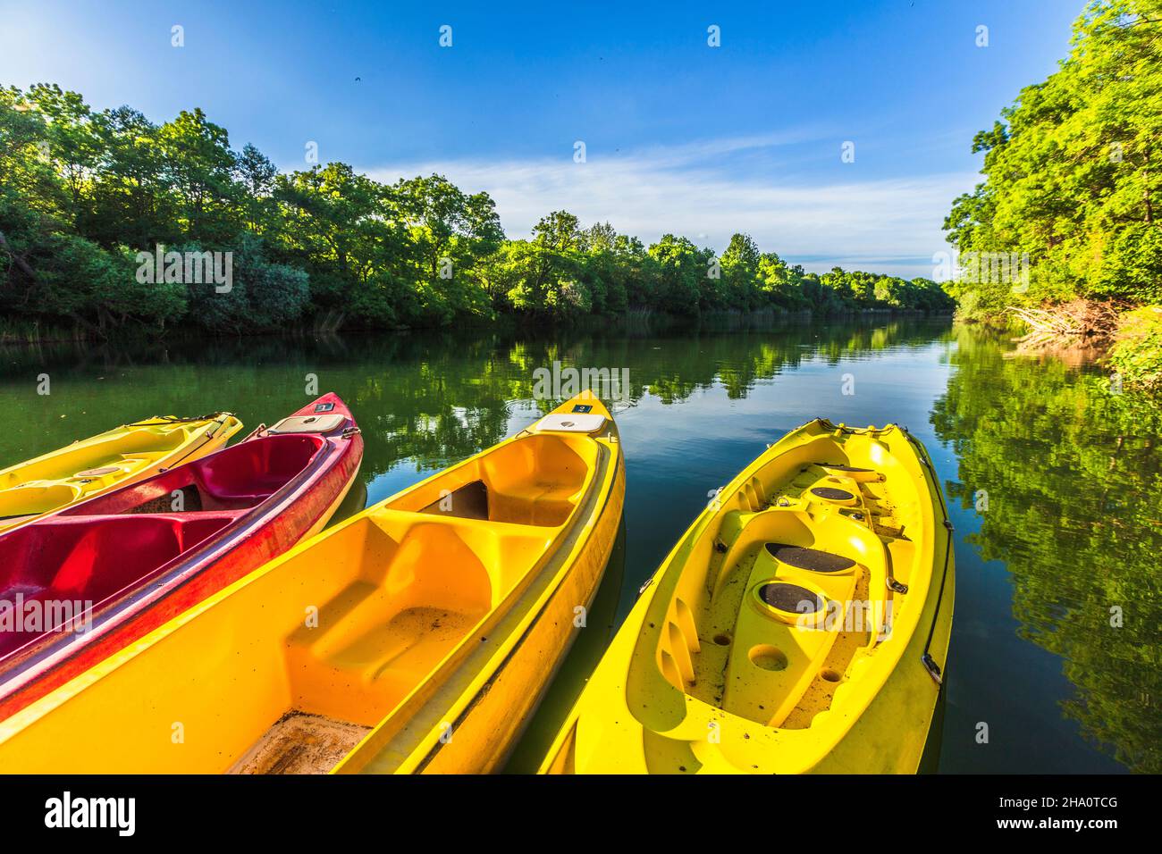 Colorful kayaks in a river Stock Photo - Alamy