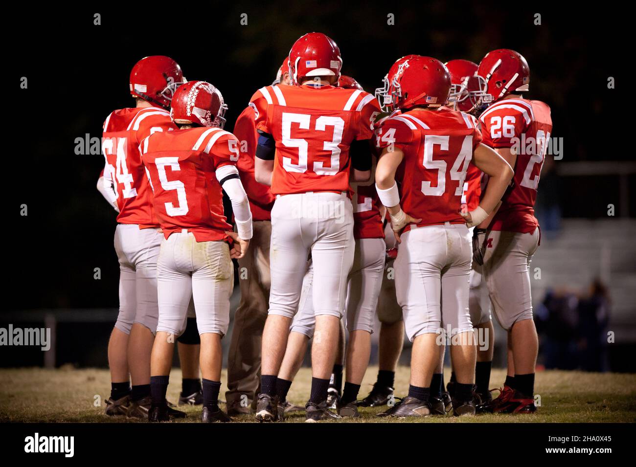 Football Team in a Huddle Stock Photo - Alamy